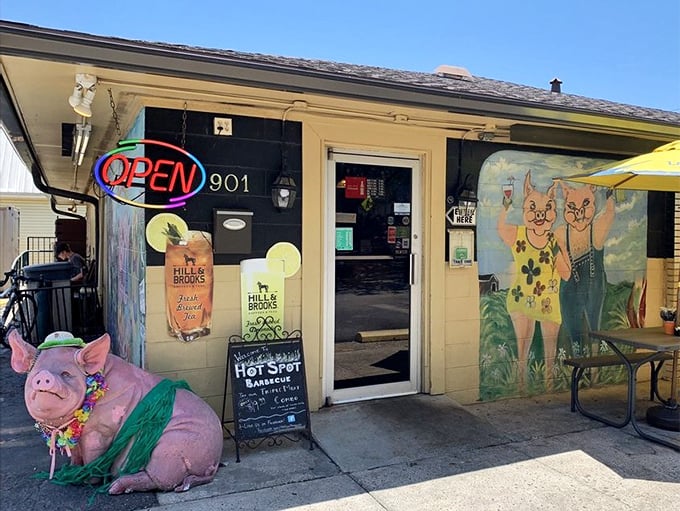 Colorful murals and outdoor seating create a carnival atmosphere where serious barbecue meets pure Florida fun.
