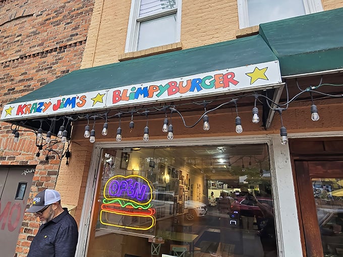 The neon burger sign glowing in Krazy Jim's window – like a lighthouse guiding hungry souls to slider salvation.