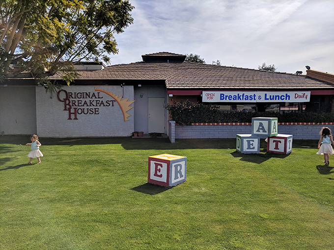 Those playful alphabet blocks on the lawn aren't just decoration – they're spelling out "E-A-T H-E-R-E" in the universal language of breakfast lovers.