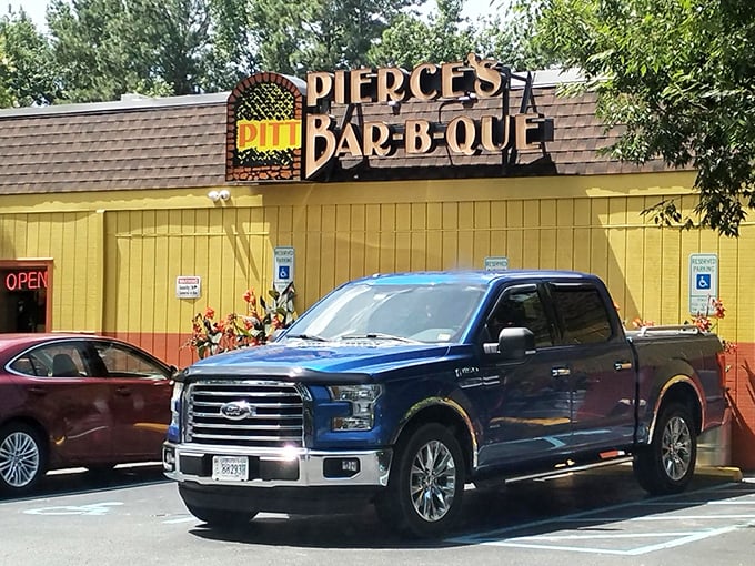 That sunny yellow building isn't compensating for anything—Pierce's knows exactly what it's doing with that smoker.