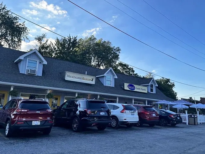 That charming white porch and blue door hide a pizza paradise that feels more like home than your actual home.
