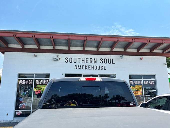 Clean white walls and a straightforward sign—because when your barbecue speaks this loudly, the building can whisper.