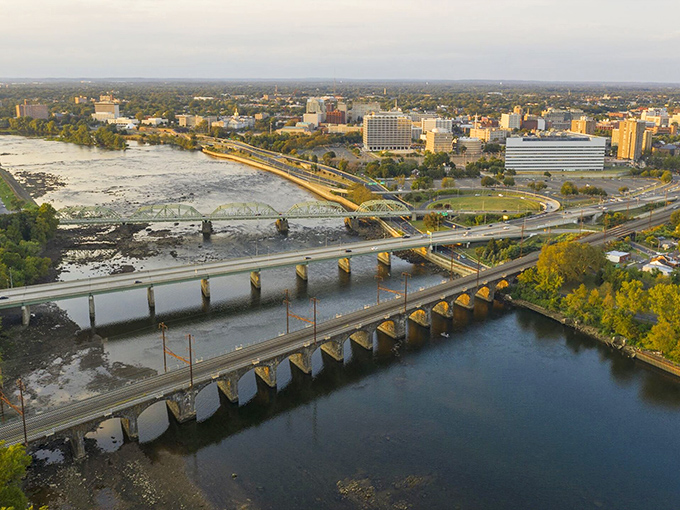 Wilmington's skyline greets travelers crossing the Christina River. City lights and water reflections—Delaware's own mini-Manhattan moment.