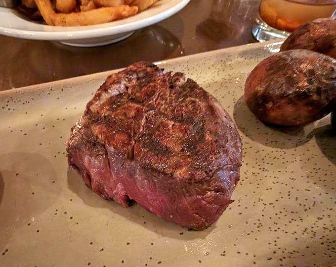 Behold the 8-ounce filet mignon—a masterpiece of meat so perfectly cooked it makes vegetarians question their life choices.