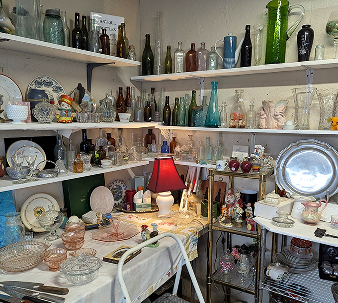 A museum of domestic history displayed on shelves – each glass piece whispering stories of Sunday dinners and holiday celebrations past.