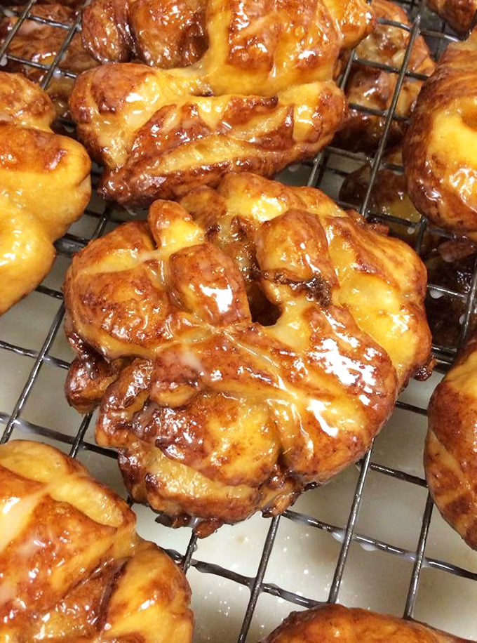The legendary apple fritter—a beautiful chaos of cinnamon-spiced apple chunks and crispy edges that makes grown adults close their eyes in reverence.