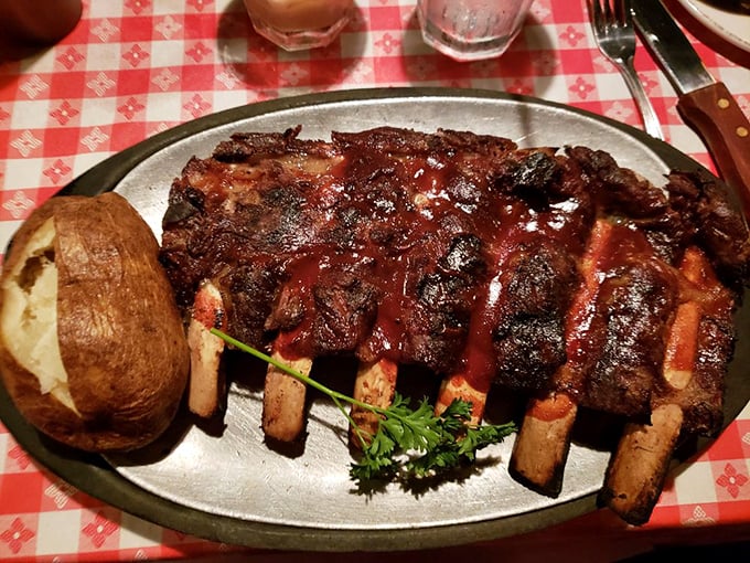 The Tomahawk steak arrives like a prehistoric trophy, its bone extending majestically beyond the plate. Caveman dining at its finest.