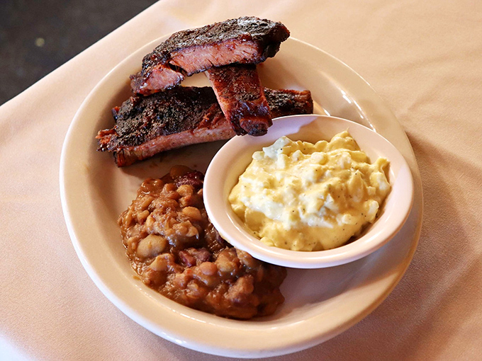 BBQ ribs, baked beans, and mac & cheese—the holy trinity of comfort food that makes you want to loosen your belt before you even start eating.