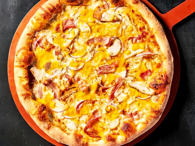 The BBQ Chicken Pizza that launched a thousand cravings—where tangy sauce meets melty cheese in a relationship more harmonious than most Hollywood marriages.