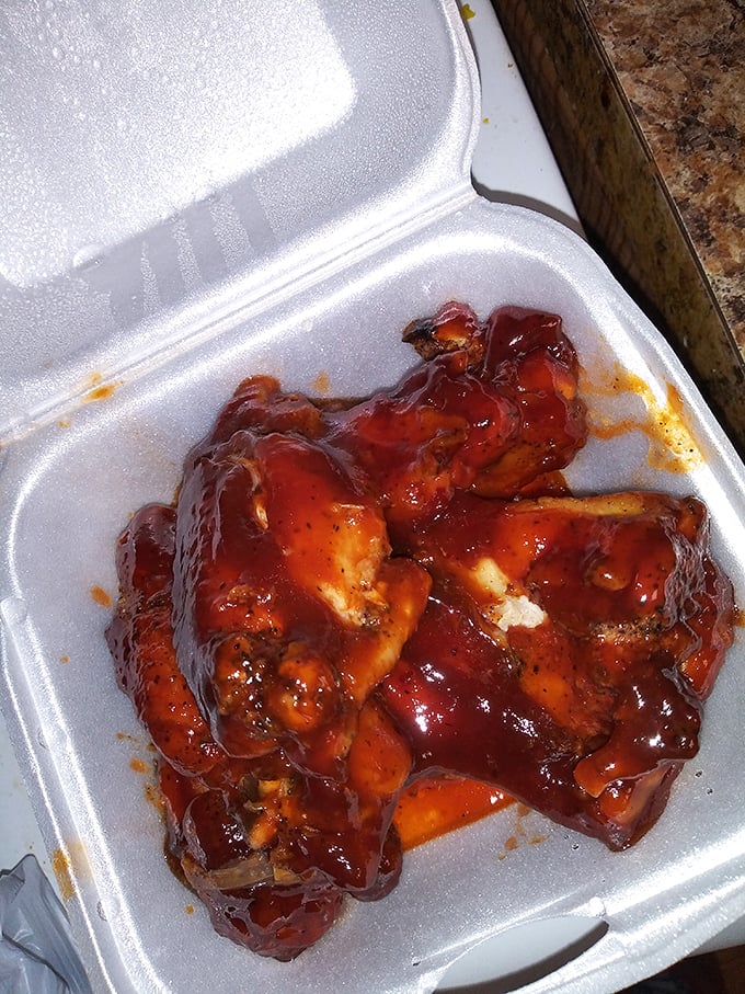 These BBQ chicken wings aren't just food—they're an event, glistening with a sauce so good you'll be contemplating licking the takeout container.