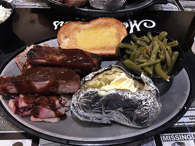 BBQ nirvana on a plate: smoky ribs, tender meat, buttery potato, and green beans that actually taste good. Grandma would approve of these vegetables.