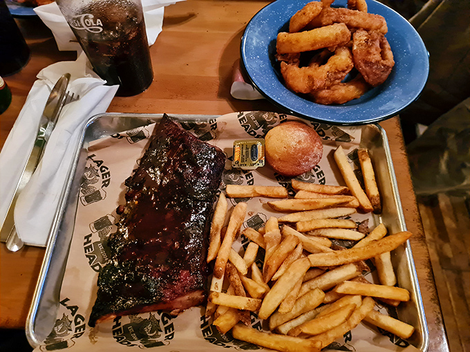 These ribs don't just fall off the bone—they practically leap onto your fork, glistening with sauce and begging to be devoured alongside those golden fries.