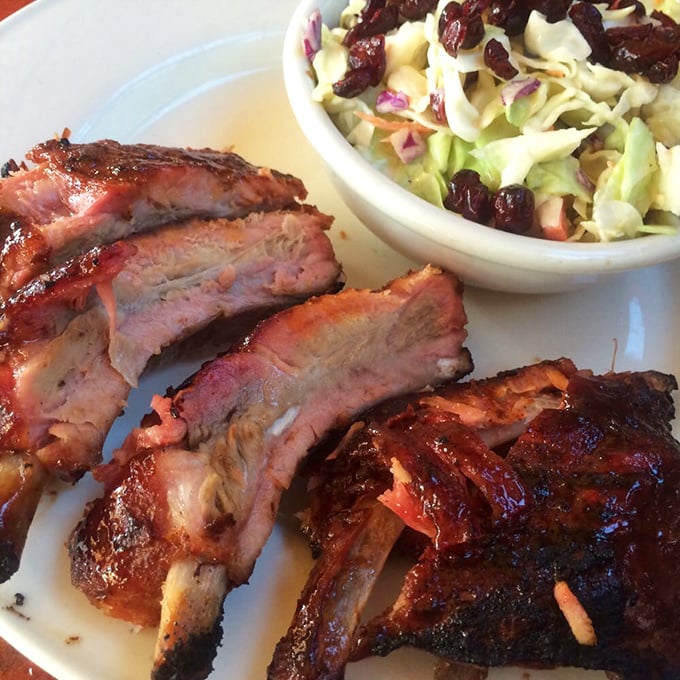 These ribs don't just fall off the bone—they practically leap onto your fork. That smoke ring is the BBQ equivalent of a Michelin star.