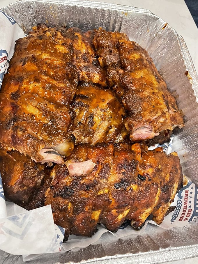 Meat candy alert! These baby back ribs, glistening with sauce and sporting that perfect smoke ring, are what barbecue dreams are made of.