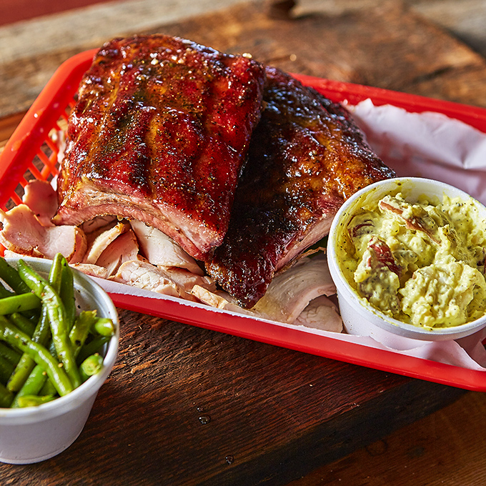 These ribs aren't just cooked, they're transformed—sporting a smoke ring that would make Saturn jealous and a bark that's the equivalent of meat candy.