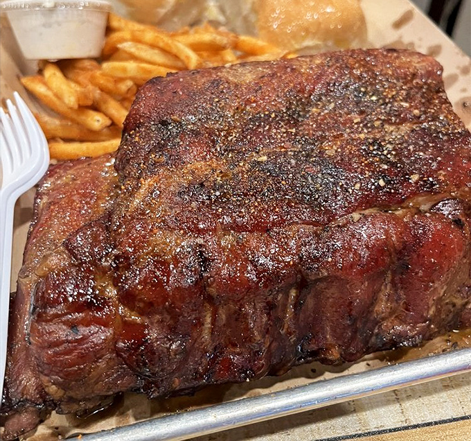 These ribs don't just fall off the bone—they practically leap into your mouth, their spice-crusted exterior hiding meat so tender it's practically indecent.
