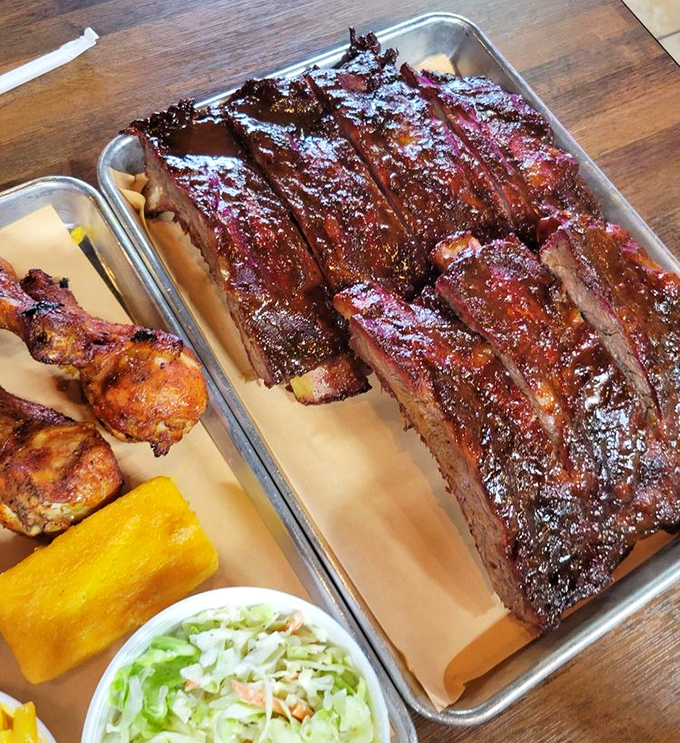 Behold the star attraction: ribs with a bark so perfect they should be in a museum. That smoke ring isn't just pink—it's practically neon, announcing "This is how it's done."