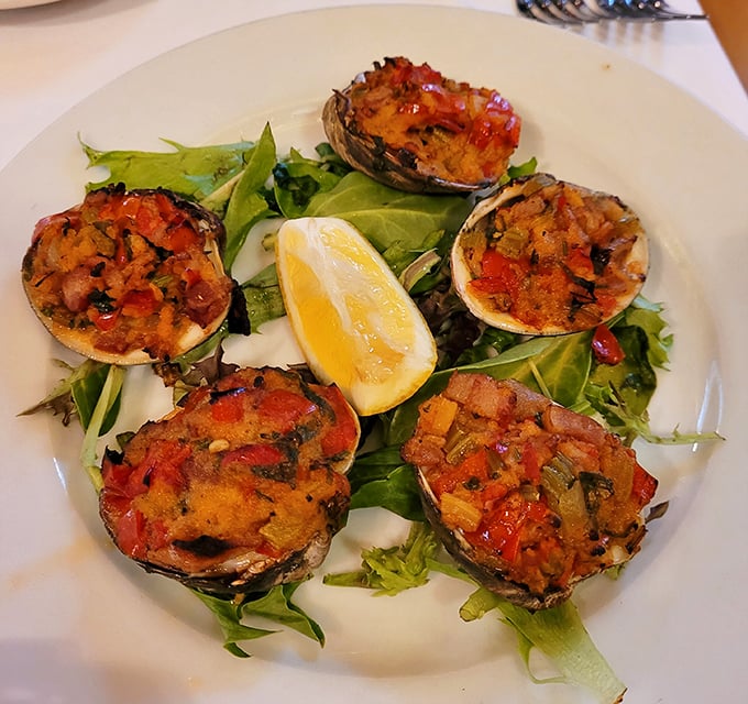 These baked clams aren't just appetizers – they're edible overtures, each shell a tiny stage for breadcrumbs, peppers, and herbs performing in perfect harmony.
