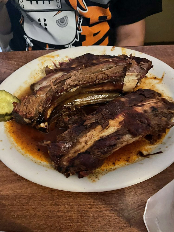 Behold the beef ribs that could make a vegetarian question their life choices – pure smoky perfection.