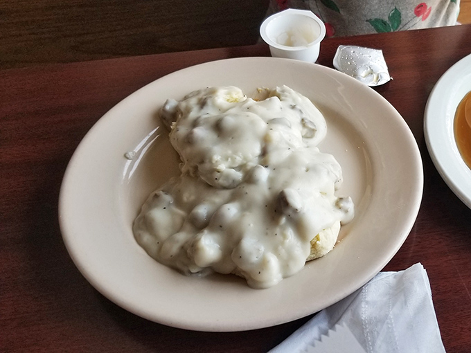 These biscuits and gravy aren't just a menu item—they're a religious experience. The gravy-to-biscuit ratio is what mathematicians call "perfect."