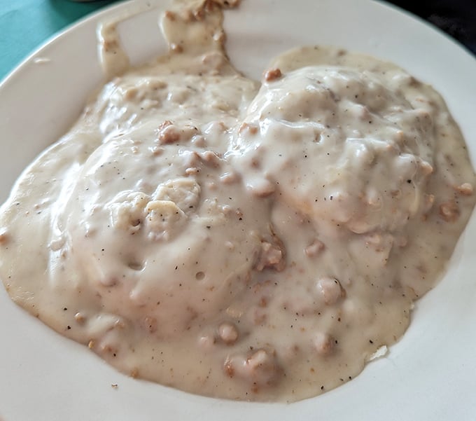 Behold the star attraction: Jimmy's legendary biscuits and gravy. That pepper-flecked cream sauce isn't just breakfast—it's edible therapy on a plate.