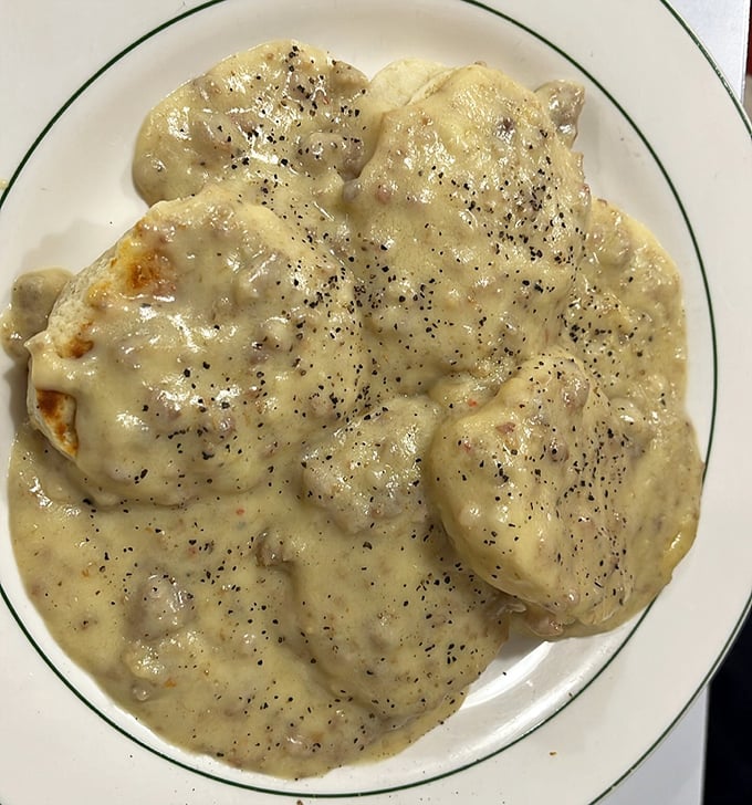 Behold the holy grail of diner breakfasts—biscuits and gravy with enough black pepper to wake you up faster than the coffee. Comfort food that hugs you from the inside.