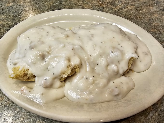 Behold the holy grail of comfort food – biscuits drowning in peppery sausage gravy so good you'll contemplate moving to Payson permanently.