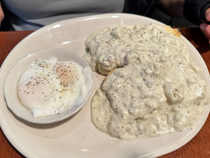 Biscuits and gravy that could make a Southern grandmother weep with joy. That pepper-speckled cream gravy doesn't just cover the biscuits—it embraces them.