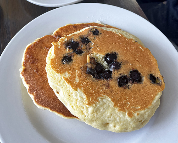 These blueberry pancakes aren't just breakfast, they're edible sunshine—golden-brown perfection studded with berries that pop like tiny flavor bombs with each bite.