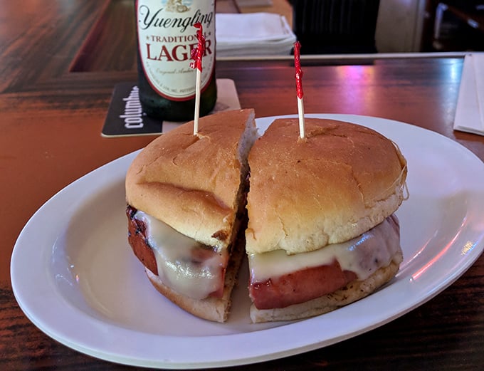 The legendary fried bologna sandwich in all its glory—thick-cut, perfectly grilled, and melty with cheese. Childhood nostalgia transformed into culinary genius.