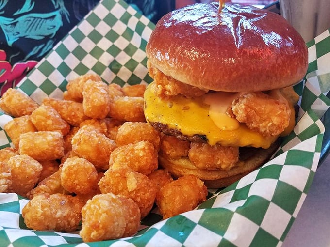 Behold the tater tot burger – because sometimes genius comes dressed in crispy potato nuggets and melted cheese.