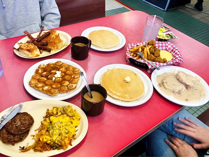 Breakfast nirvana achieved! Golden pancakes, crispy hashbrowns, and biscuits with gravy—a spread that makes morning people of us all.