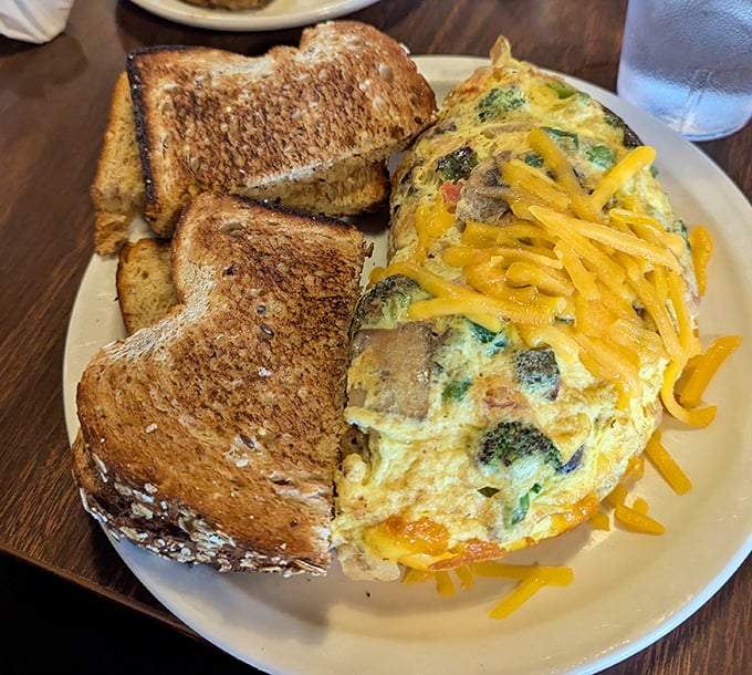 Behold the golden orb of happiness – a crab cake so perfect it deserves its own spotlight.