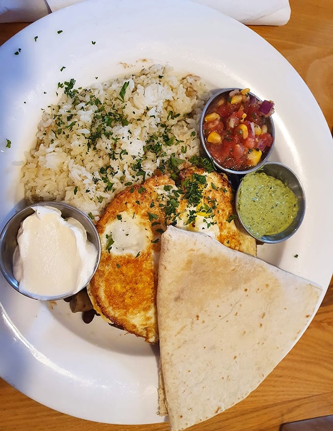 This plate arrives looking like sunshine itself decided to become breakfast—colorful, generous, and absolutely irresistible.