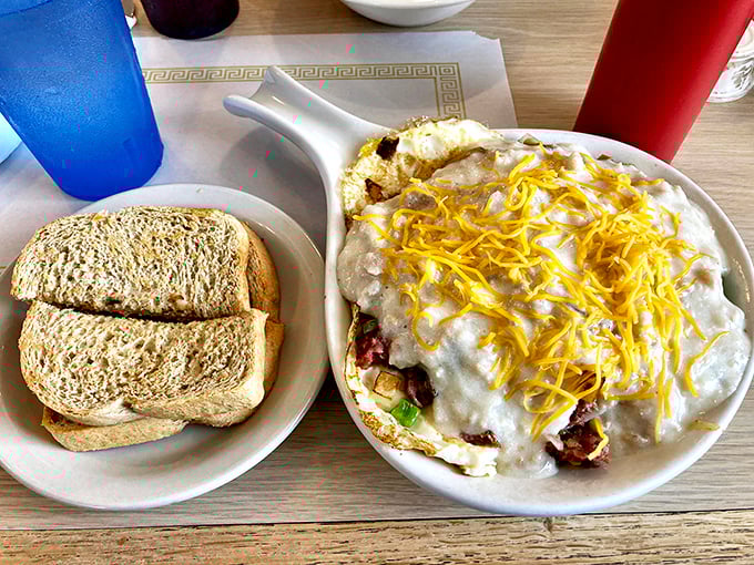 This breakfast skillet is what morning dreams are made of—cheese-crowned comfort that says "your diet can start tomorrow."