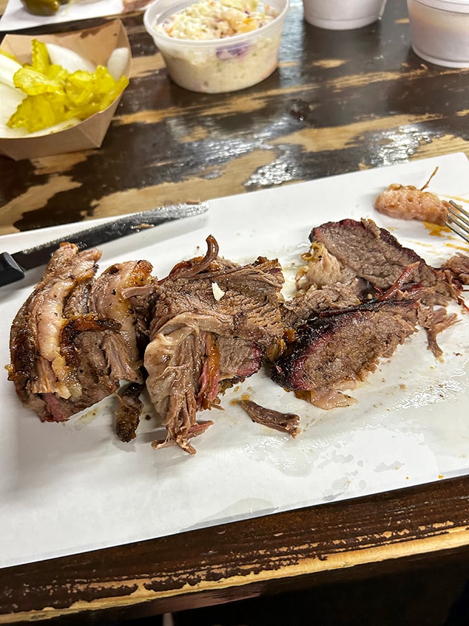 Brisket so tender it practically surrenders to your fork, with a smoke ring that BBQ aficionados would frame if they weren't too busy devouring it.