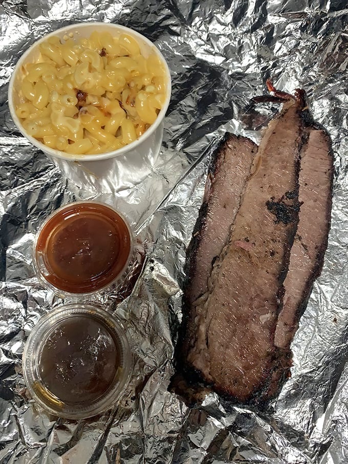 Brisket that would make a Texan weep tears of joy. That smoke ring isn't just for show—it's a pink badge of honor earned through patience and fire.