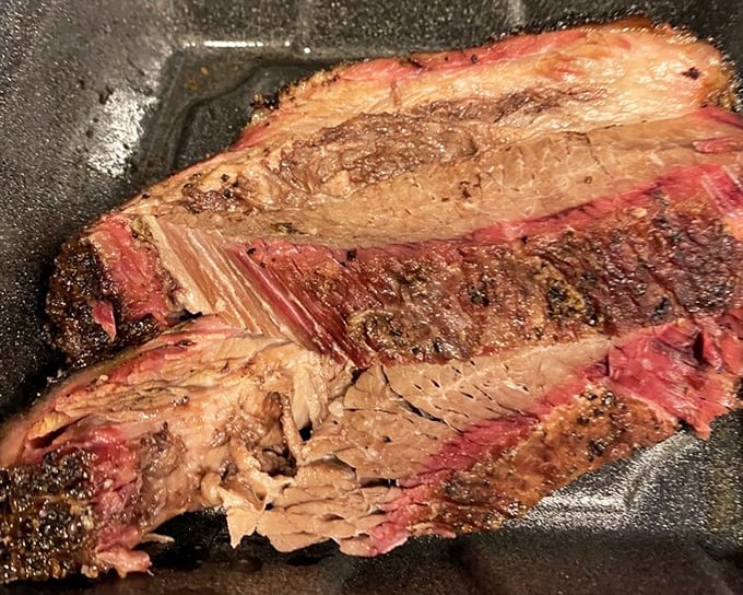 Brisket that makes time stand still. That bark, that smoke ring, that tenderness—this isn't just meat, it's edible poetry with a peppery finish.