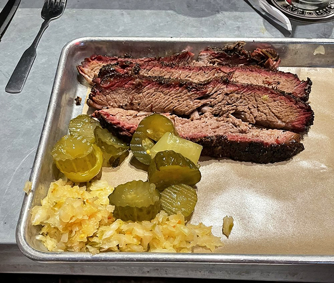 Brisket so perfect it makes Texans nervous. That smoke ring isn't just for show—it's a halo of flavor that's earned its place.