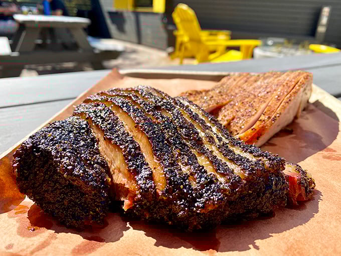 Behold the holy grail of barbecue—brisket with a bark so perfect it should be hanging in the Louvre. That smoke ring is basically a halo.