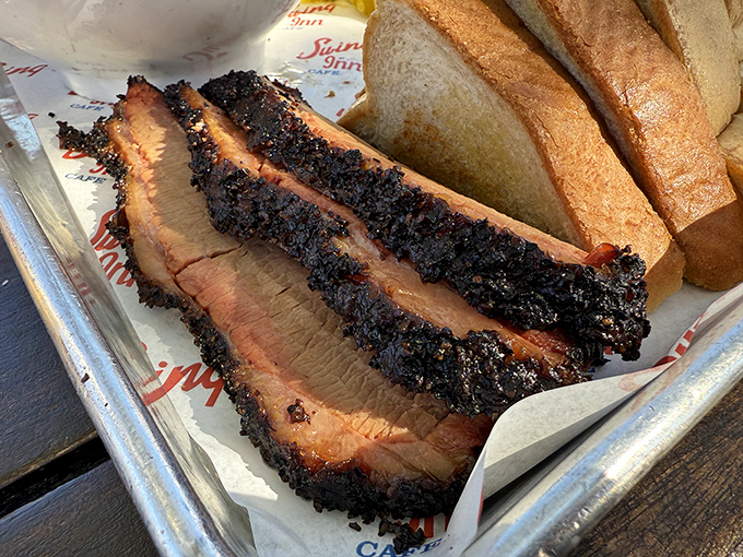 Brisket with a bark so perfect it should be in a museum. That smoke ring isn't just for show—it's a flavor halo.