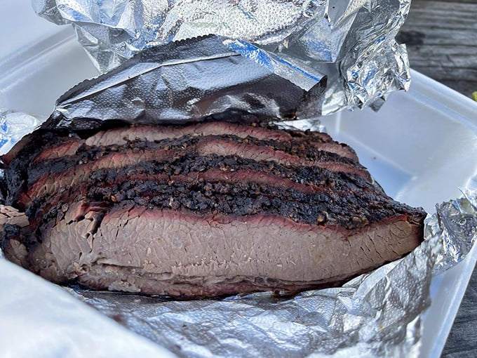 Brisket that would make a Texan weep with joy. That bark, that smoke ring, that tenderness—it's meat poetry wrapped in foil.