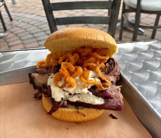 Not all heroes wear capes—some come on a bun with crispy onions and sauce. This brisket sandwich doesn't need Instagram filters to look this good.