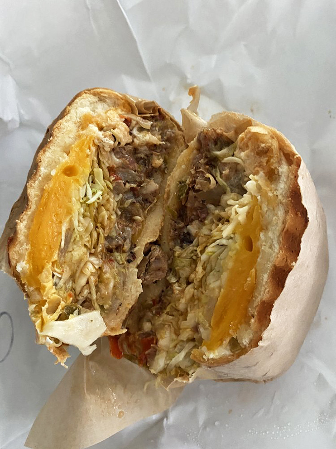 This isn't just a sandwich; it's a brisket revelation. Layers of tender meat, melted cheese, and fresh veggies create the perfect harmony in every bite.