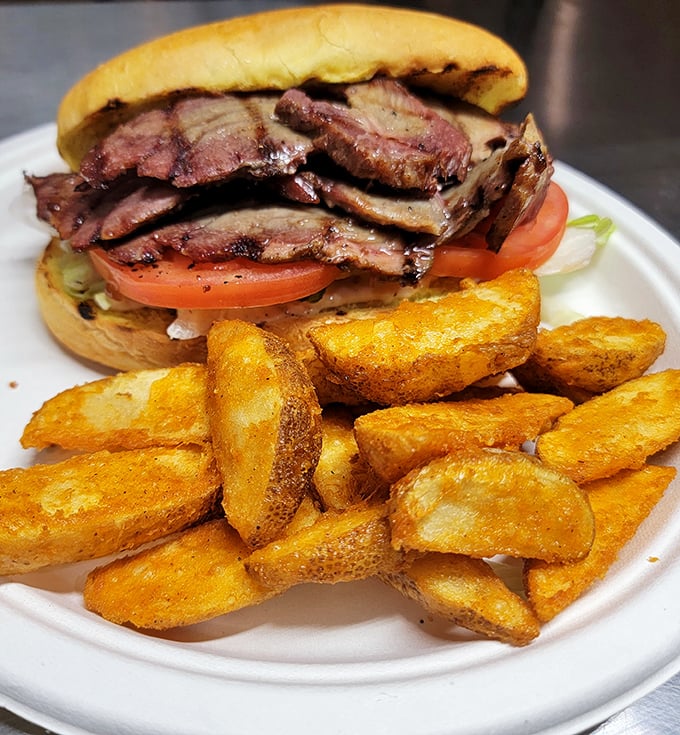 This brisket sandwich isn't just a meal, it's a masterclass in patience—thin-sliced beef with a bark so perfect it deserves its own standing ovation.