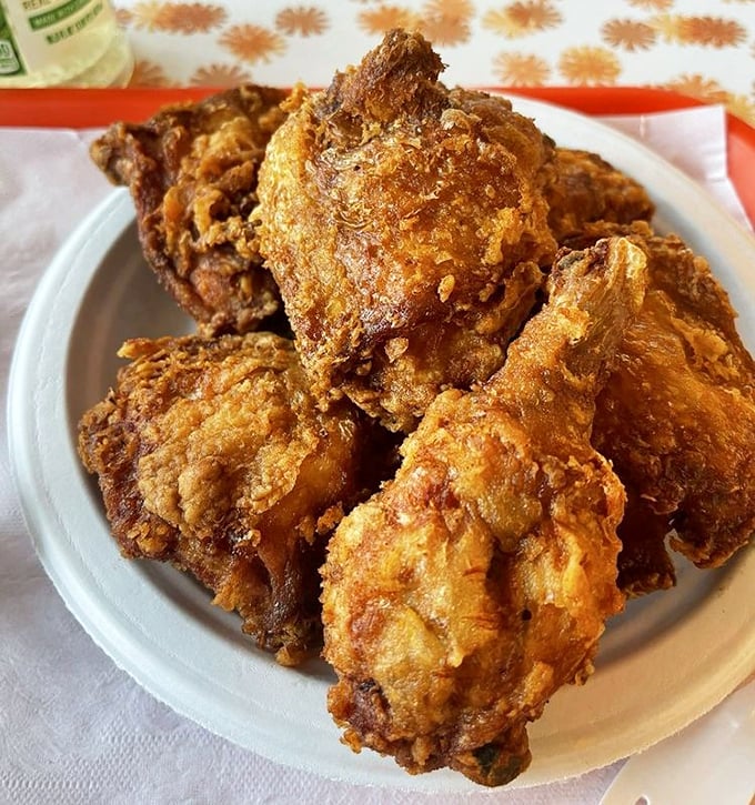 Golden-brown perfection that makes Colonel Sanders look like an amateur. This isn't just chicken—it's a masterclass in crunch-to-juiciness ratio engineering.
