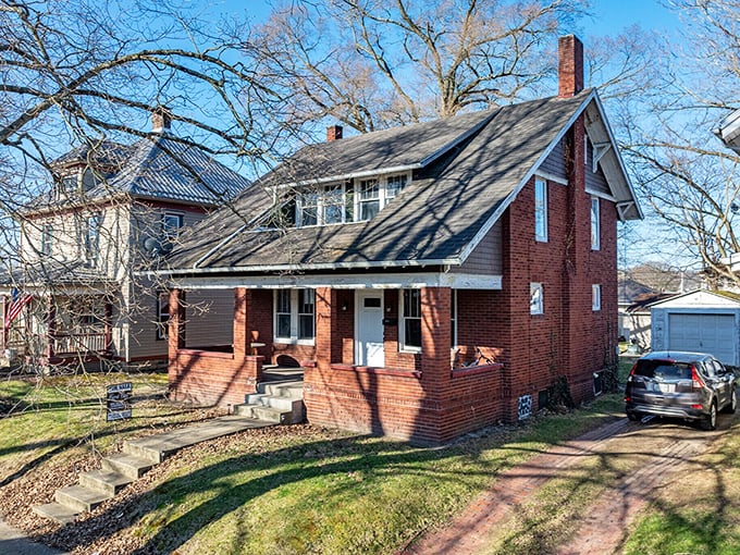 This charming brick bungalow isn't just a house; it's a testament to an era when front porches were social networks and mailmen knew your name.