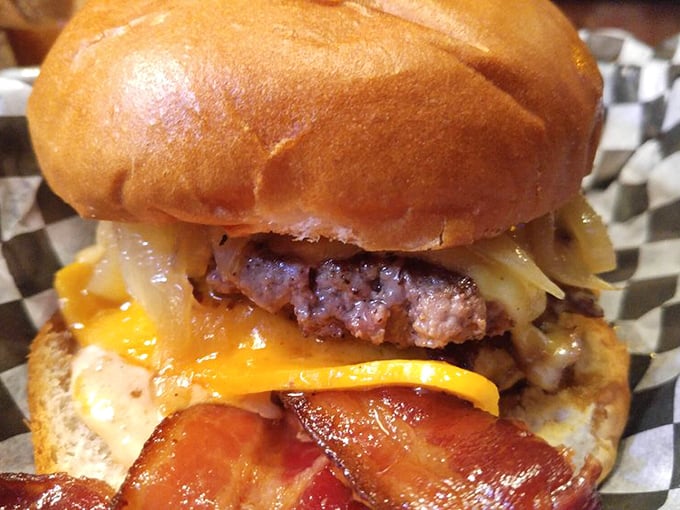 Behold the burger that launched a thousand road trips. That melty cheese cascade isn't just photogenic—it's life-changing.