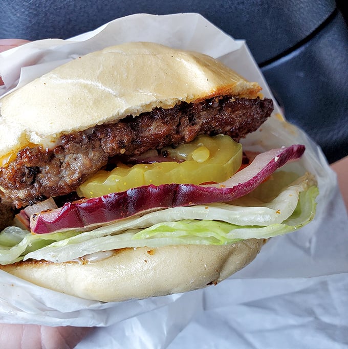 This isn't just a burger—it's a handheld masterpiece that makes your taste buds sing hallelujah.