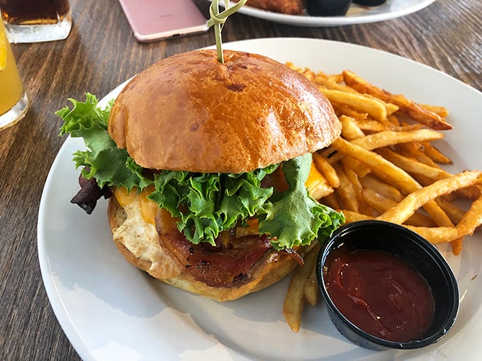 This isn't just a burger; it's an architectural masterpiece of beef, bun, and garden-fresh toppings. The fries aren't sidekicks – they're co-stars in this delicious production.